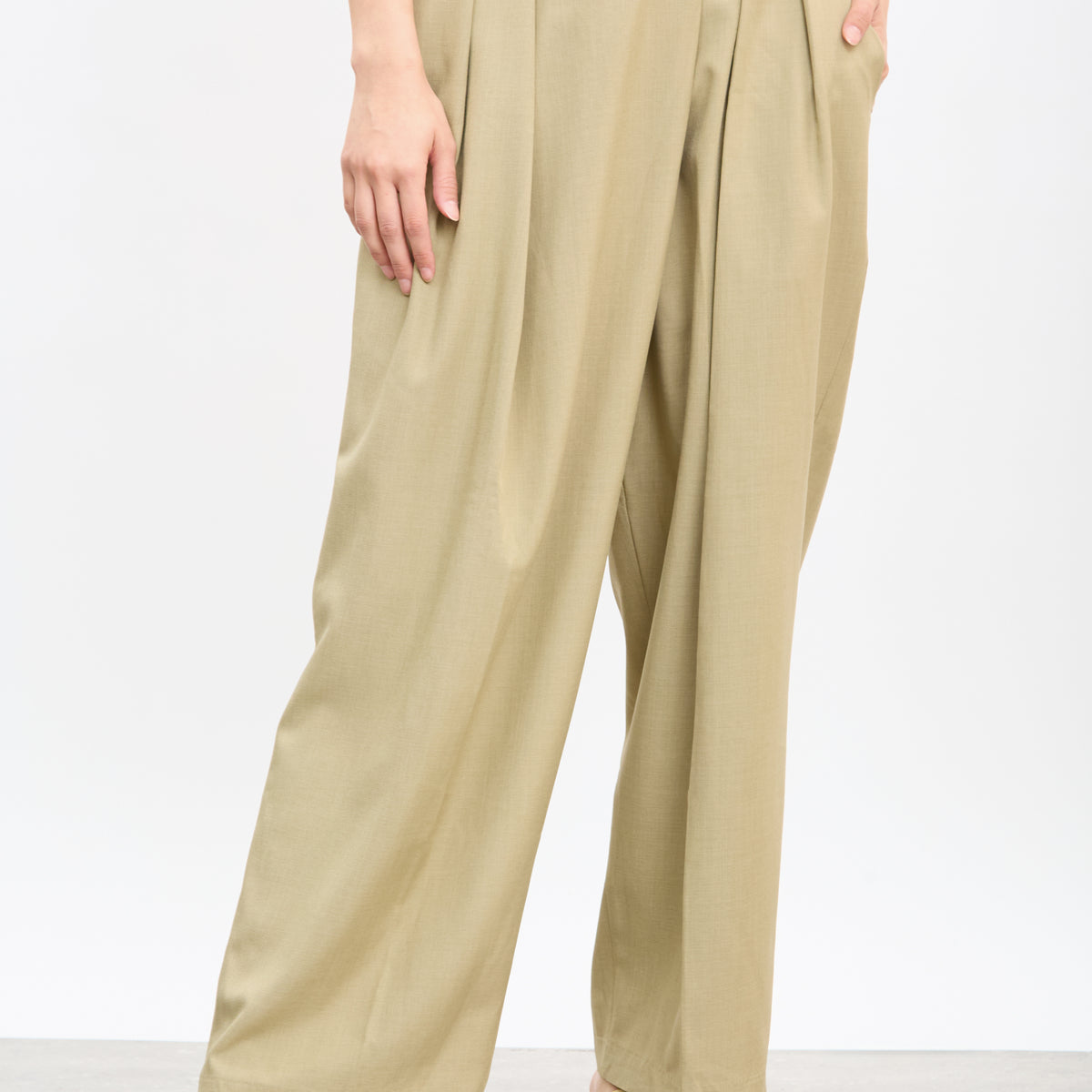 Beige multi pleat side button trousers | Glassworks London