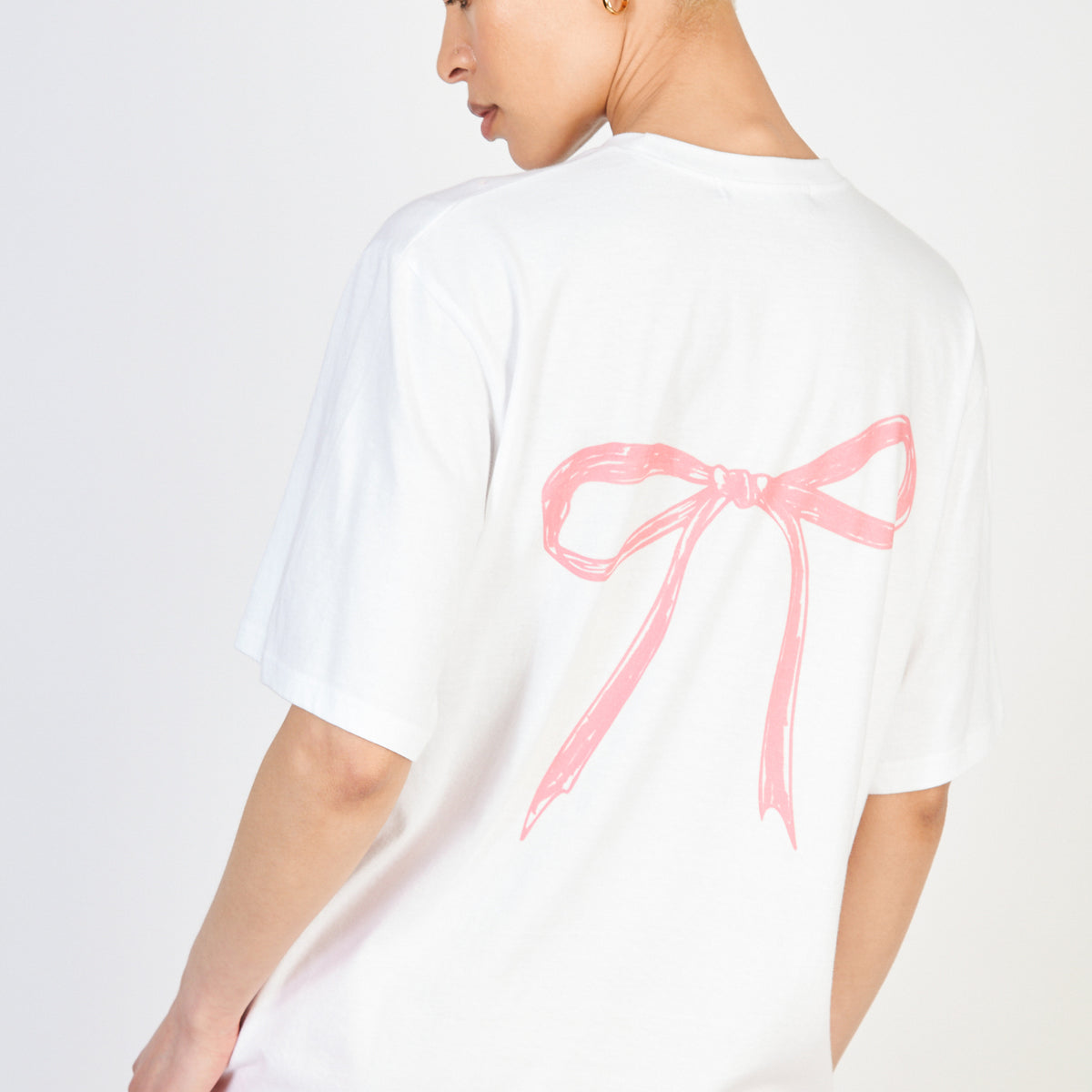 Ivory giant pink bow print t-shirt | Glassworks London