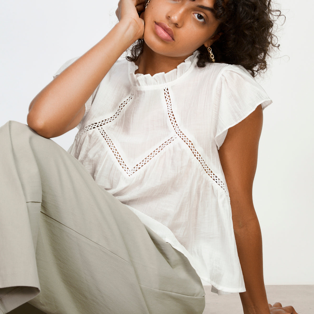 White ruffle collar sleeveless blouse | Glassworks London